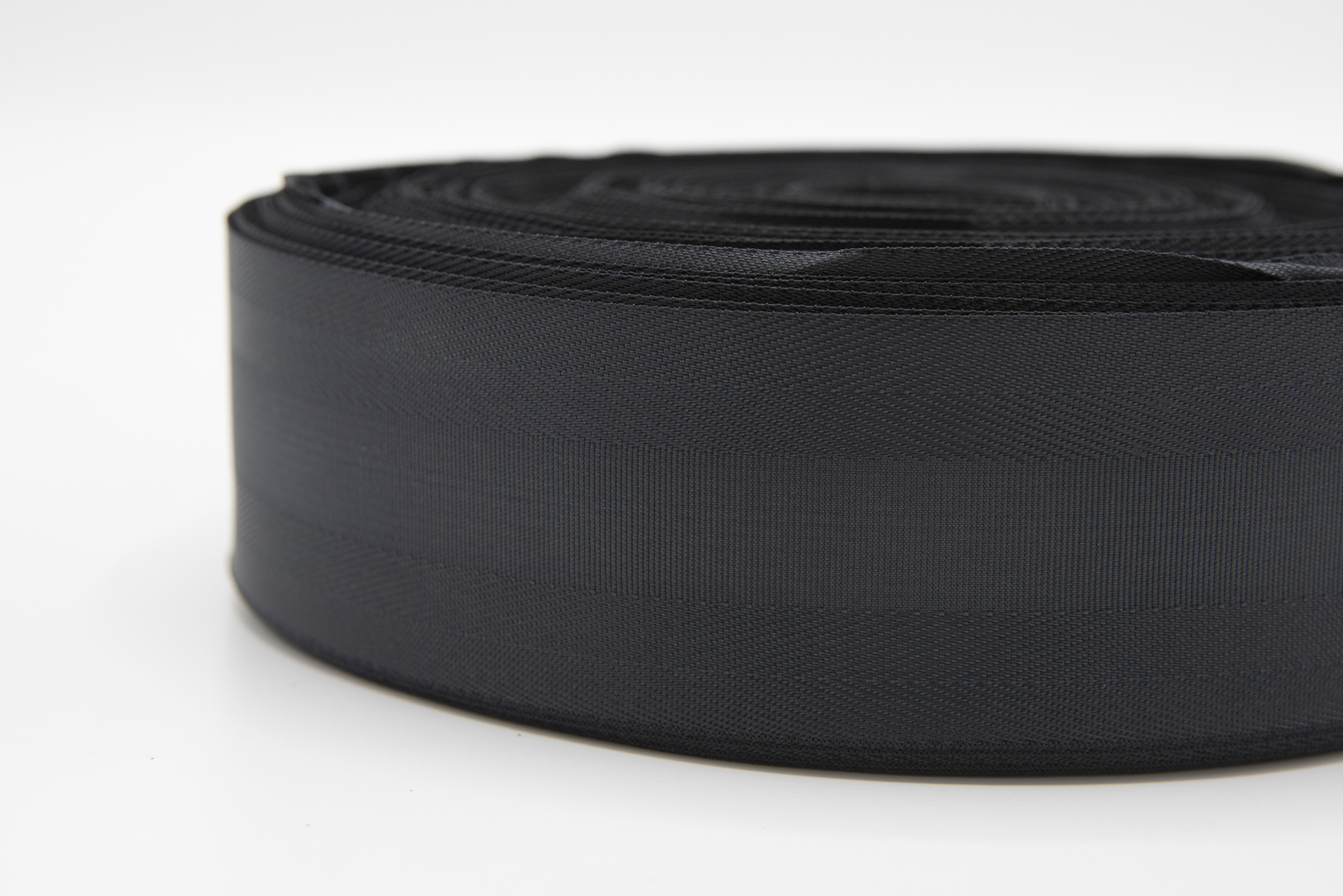 Lorentzen & Pladsen AS. PES bånd ekstra tynt 50 mm sort 501 100 m